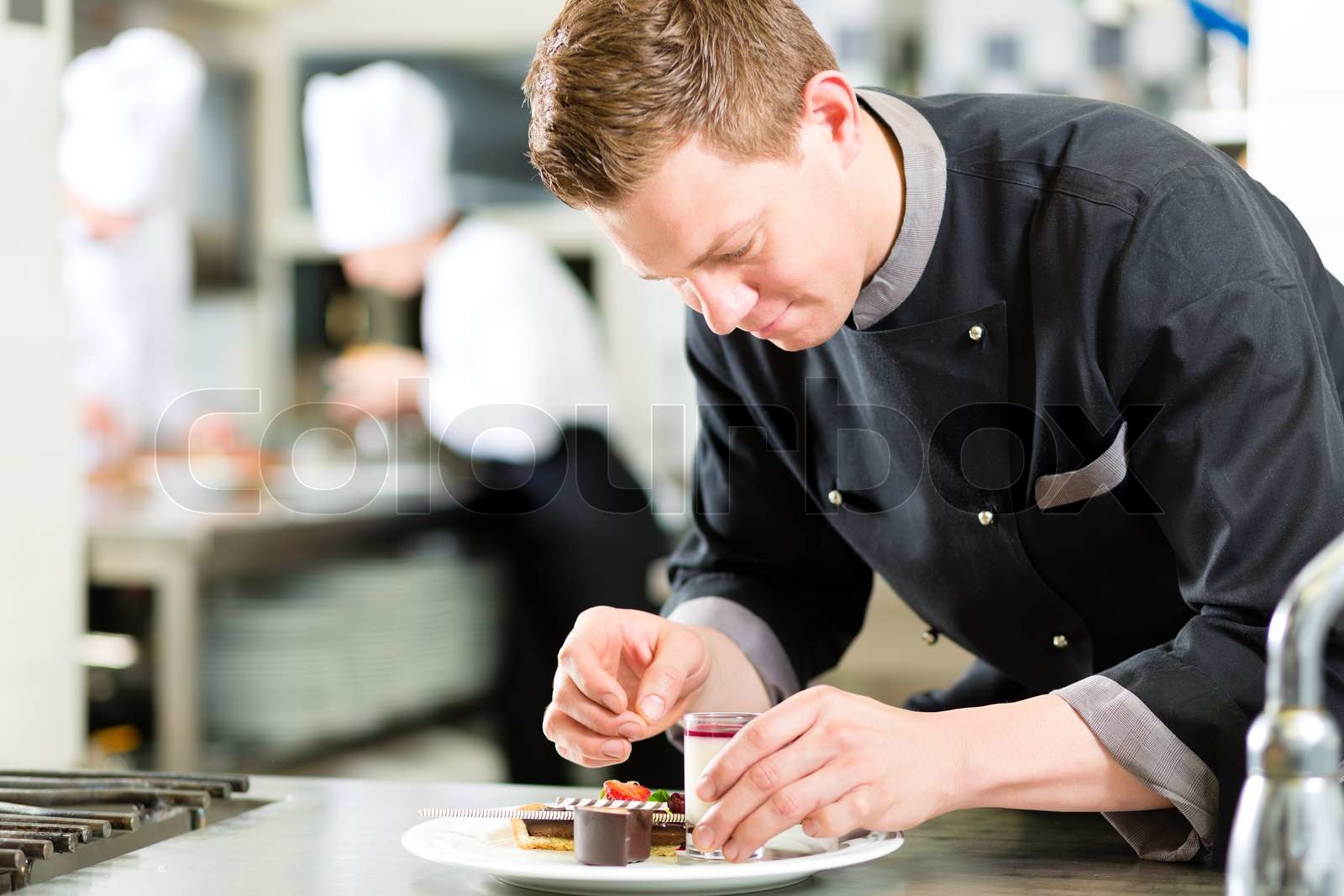 Chef as Patissier cooking in Restaurant dessert | Stock image | Colourbox