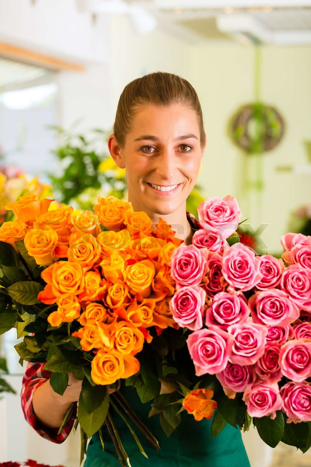 Female florist in flower shop | Stock image | Colourbox