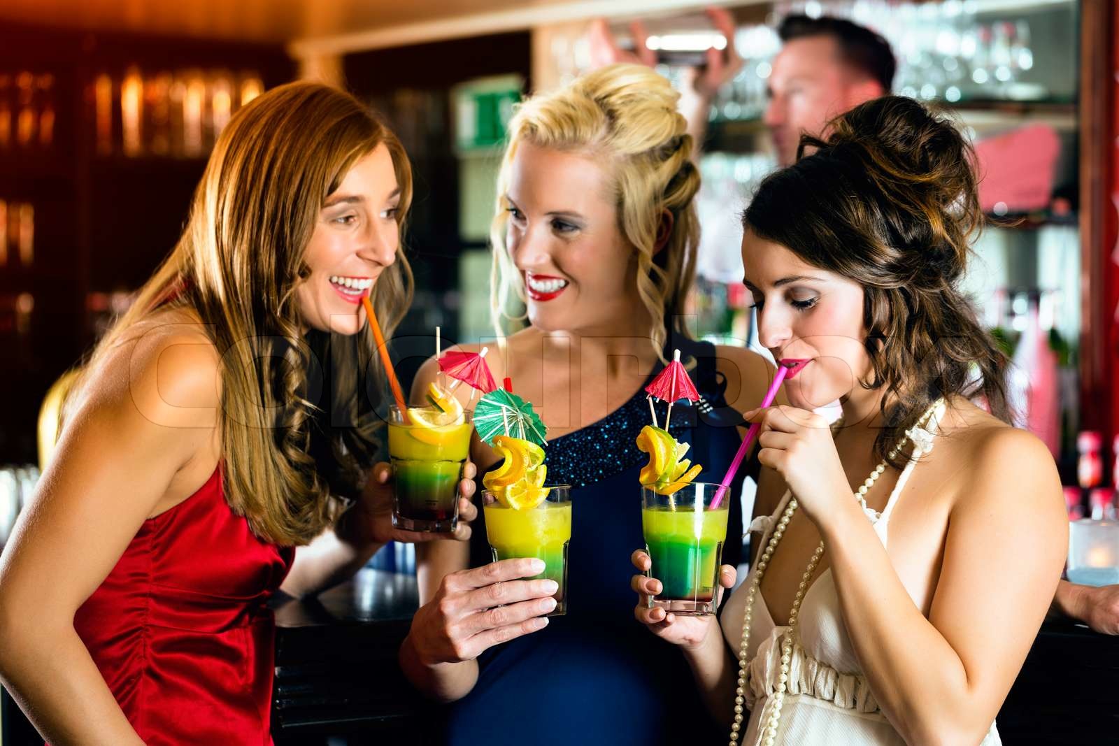 Young women with cocktails in club or Bar | Stock image | Colourbox