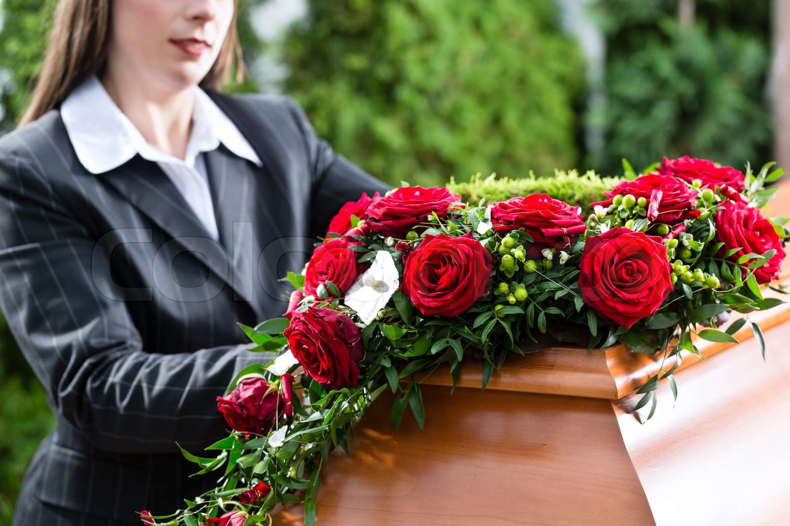 Mourning Woman at Funeral with coffin | Stock image | Colourbox