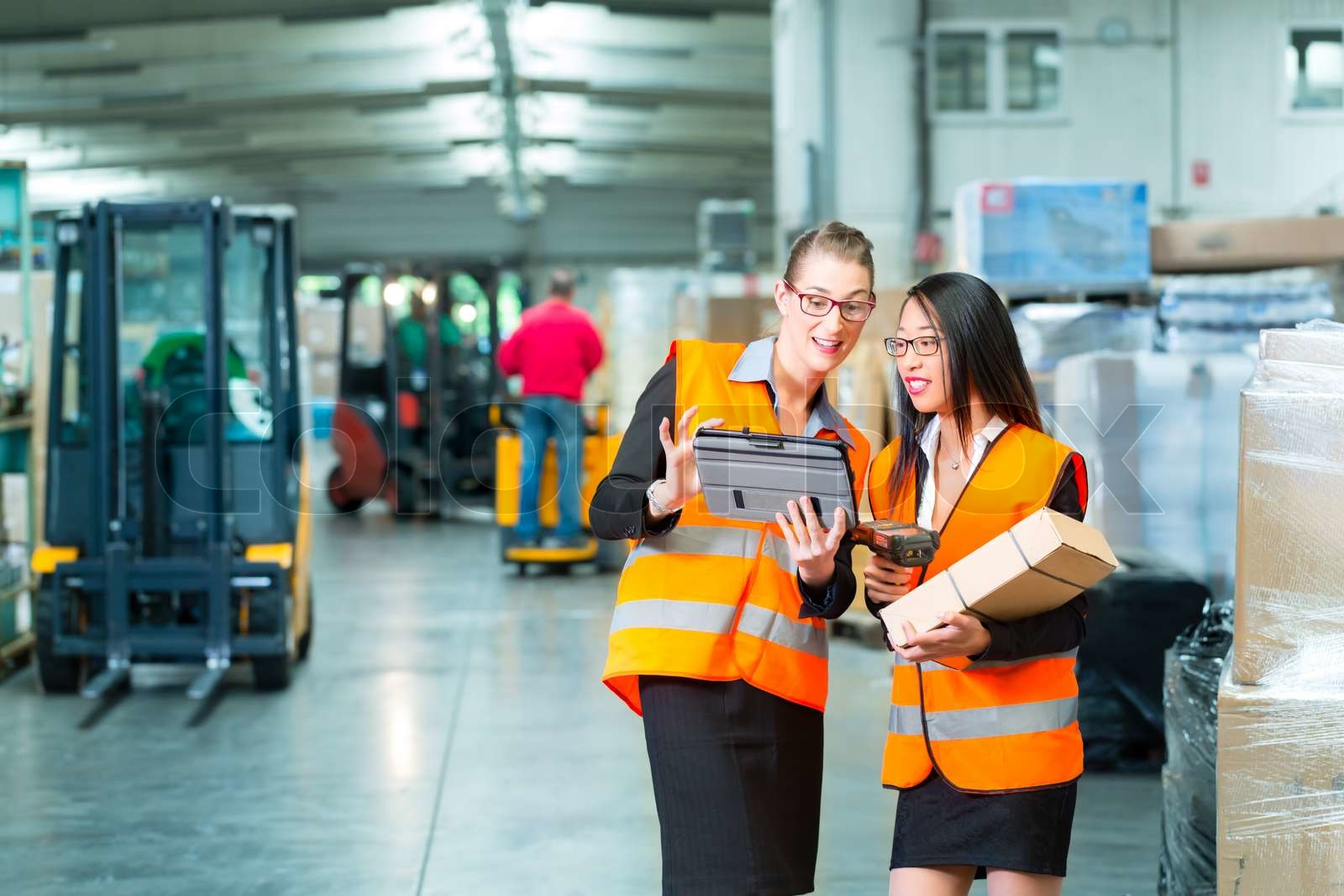 workers with package in warehouse of forwarding | Stock image | Colourbox