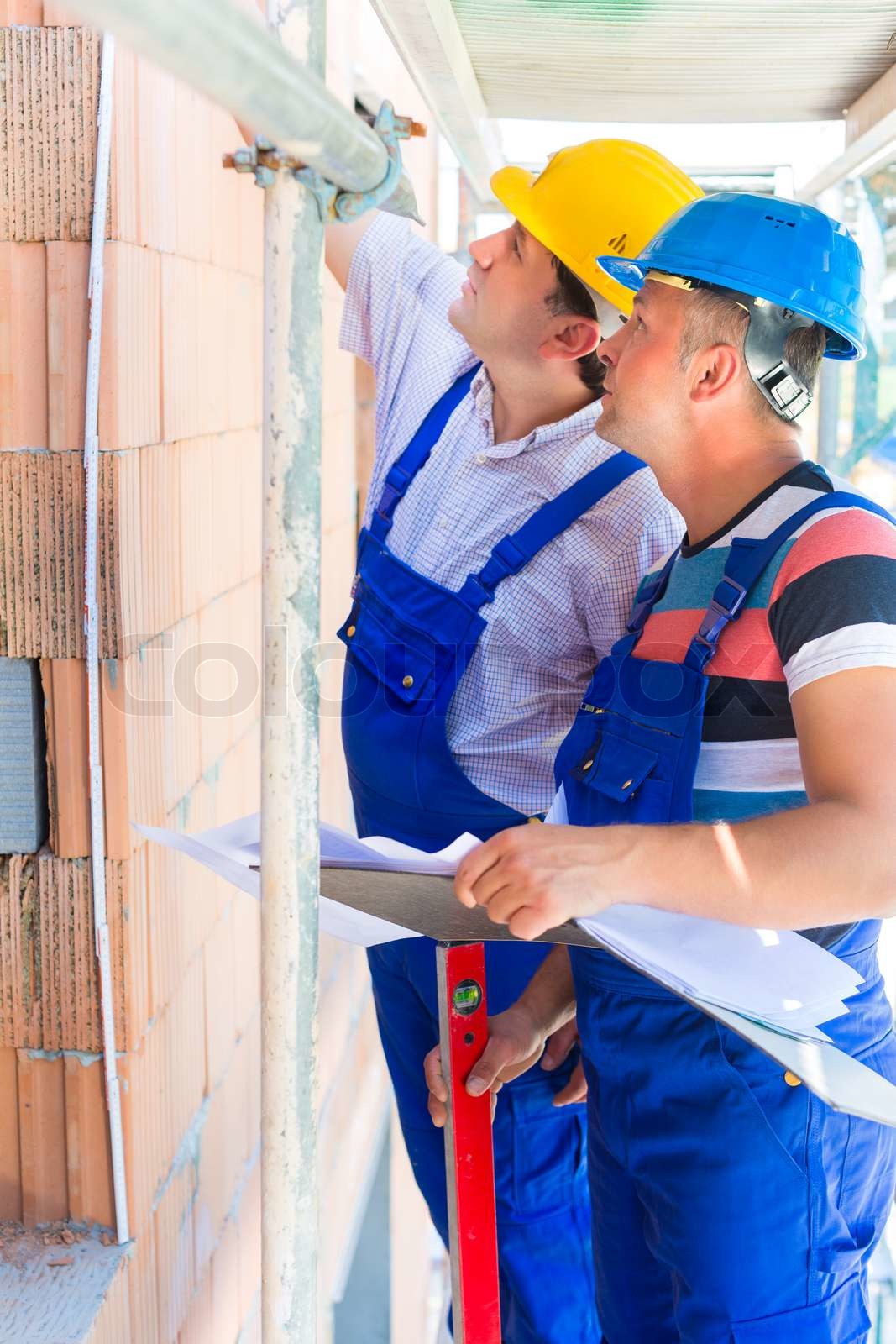 Construction workers on site checking quality | Stock image | Colourbox