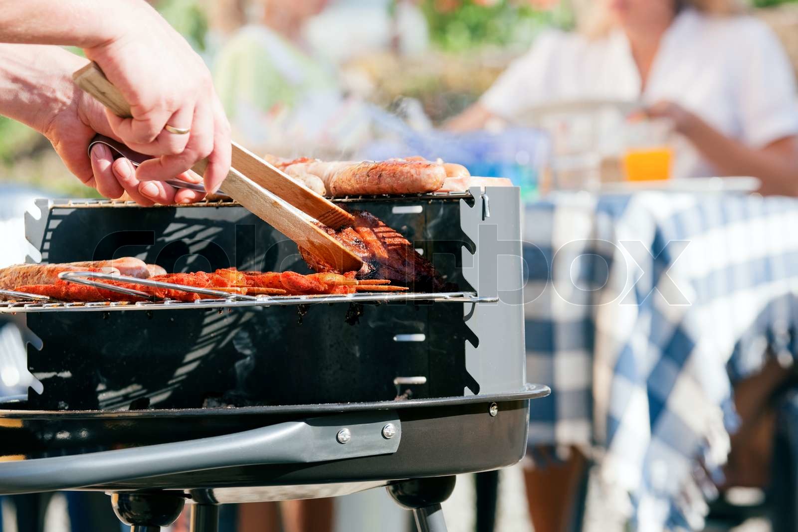 Family having a barbecue | Stock image | Colourbox