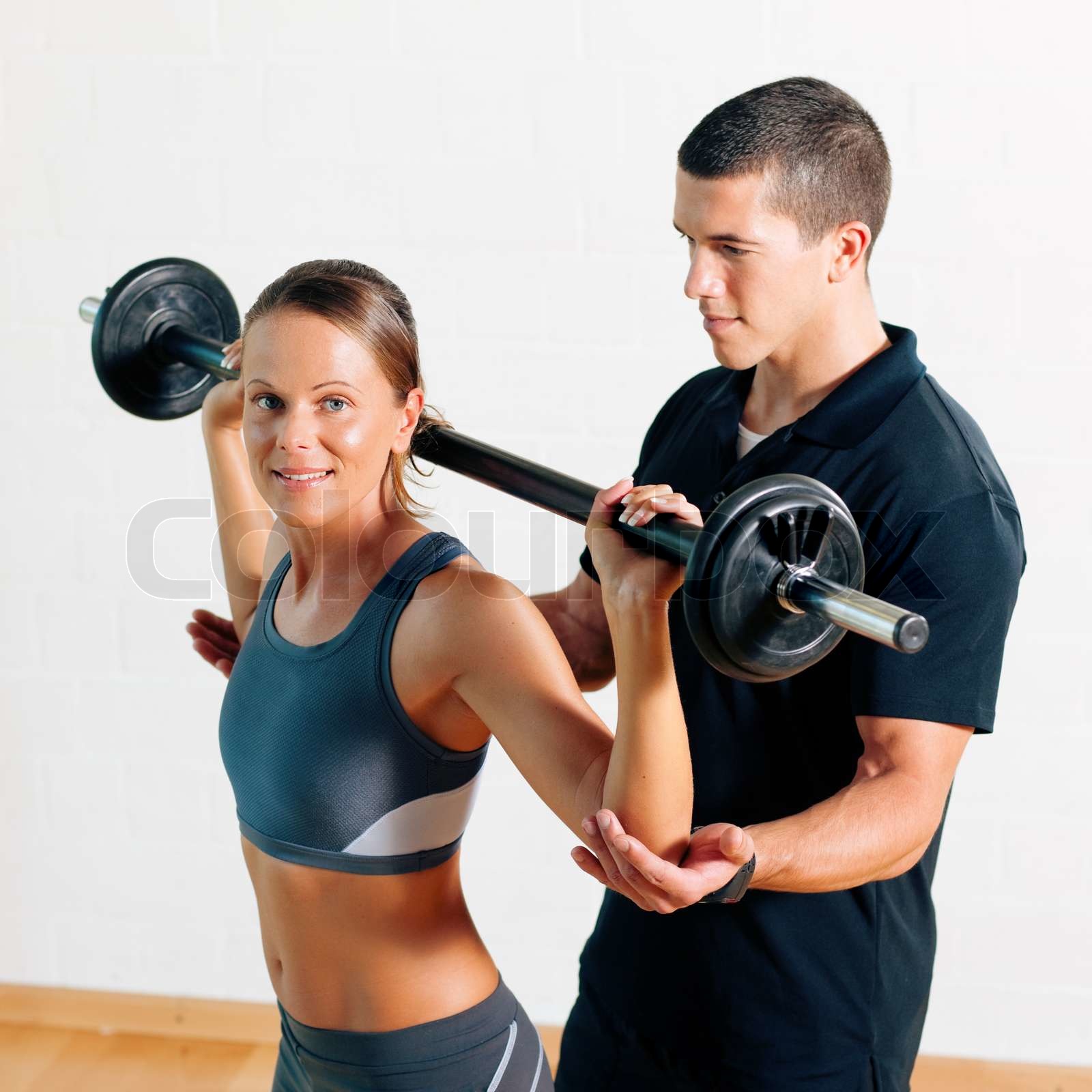 Personal Trainer in gym | Stock image | Colourbox