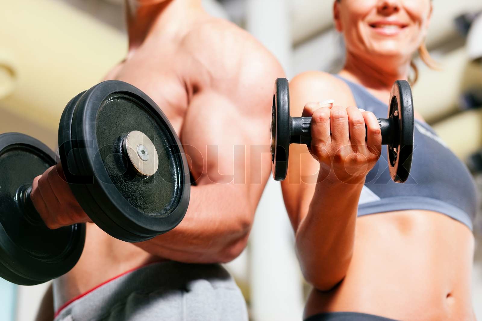 Dumbbell exercise in gym | Stock image | Colourbox