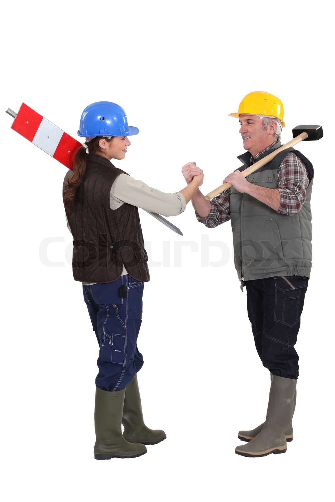 Apprentice and master shaking hands | Stock image | Colourbox