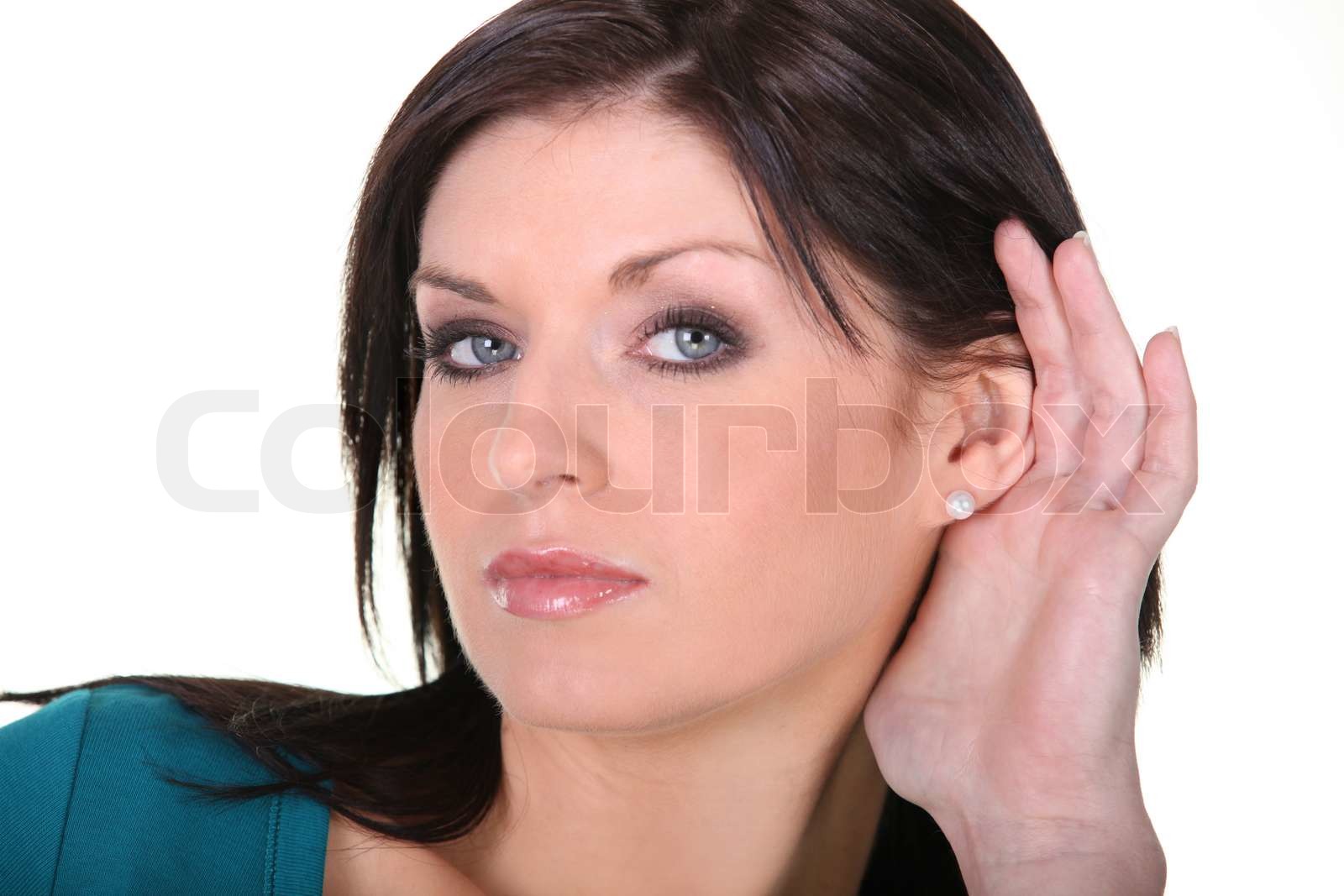 Her hand to her ear | Stock image | Colourbox