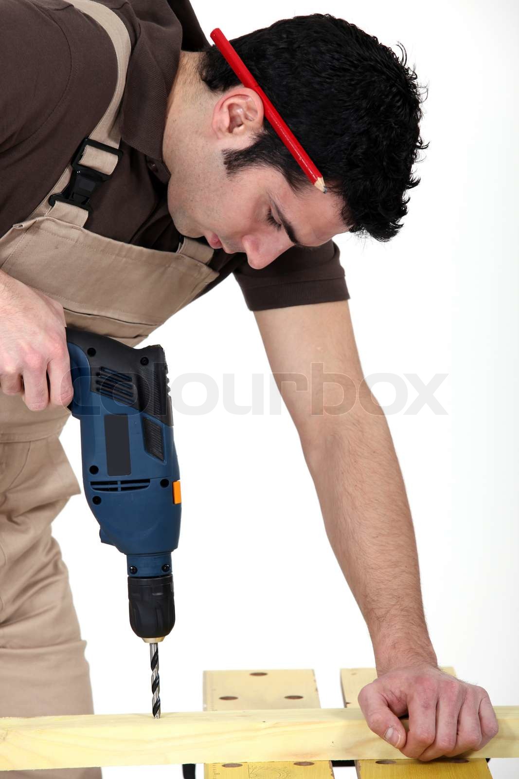 craftsman making a hole with a drill | Stock image | Colourbox