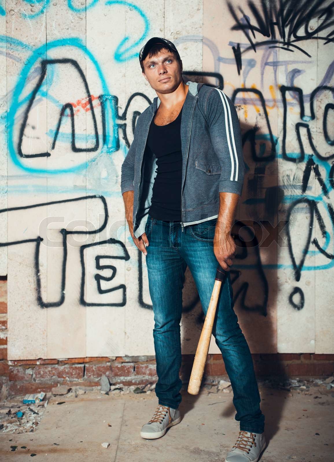 Muscular man with baseball bat | Stock image | Colourbox