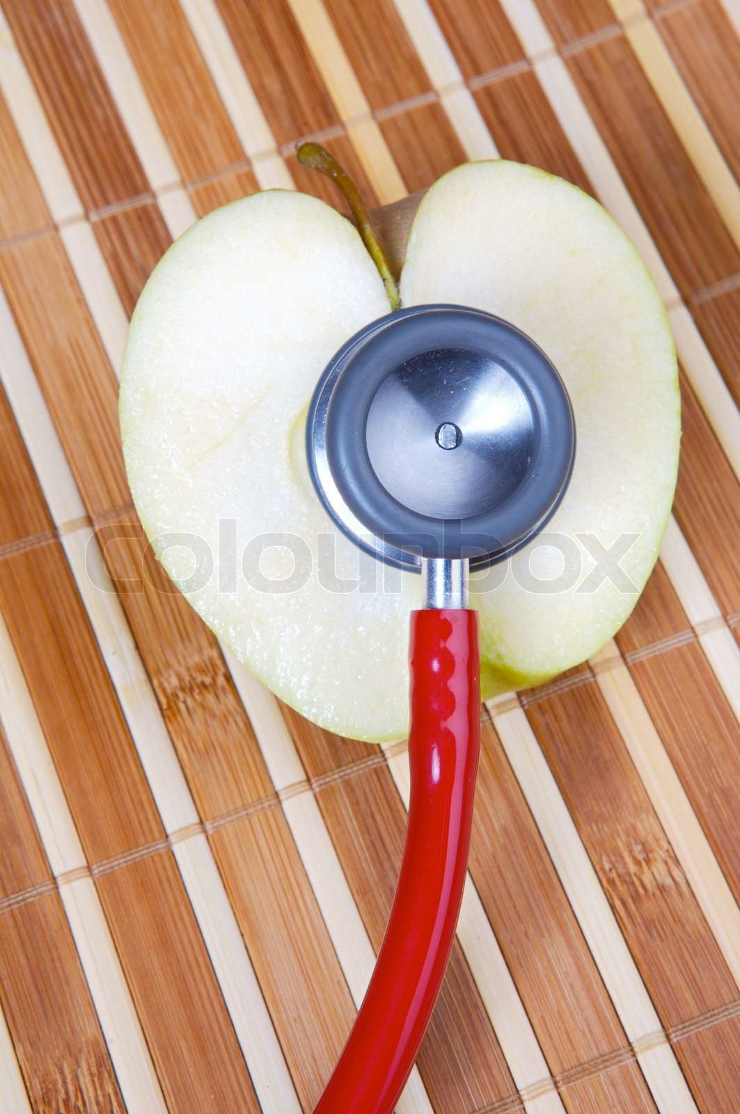 stethoscope and apple | Stock image | Colourbox