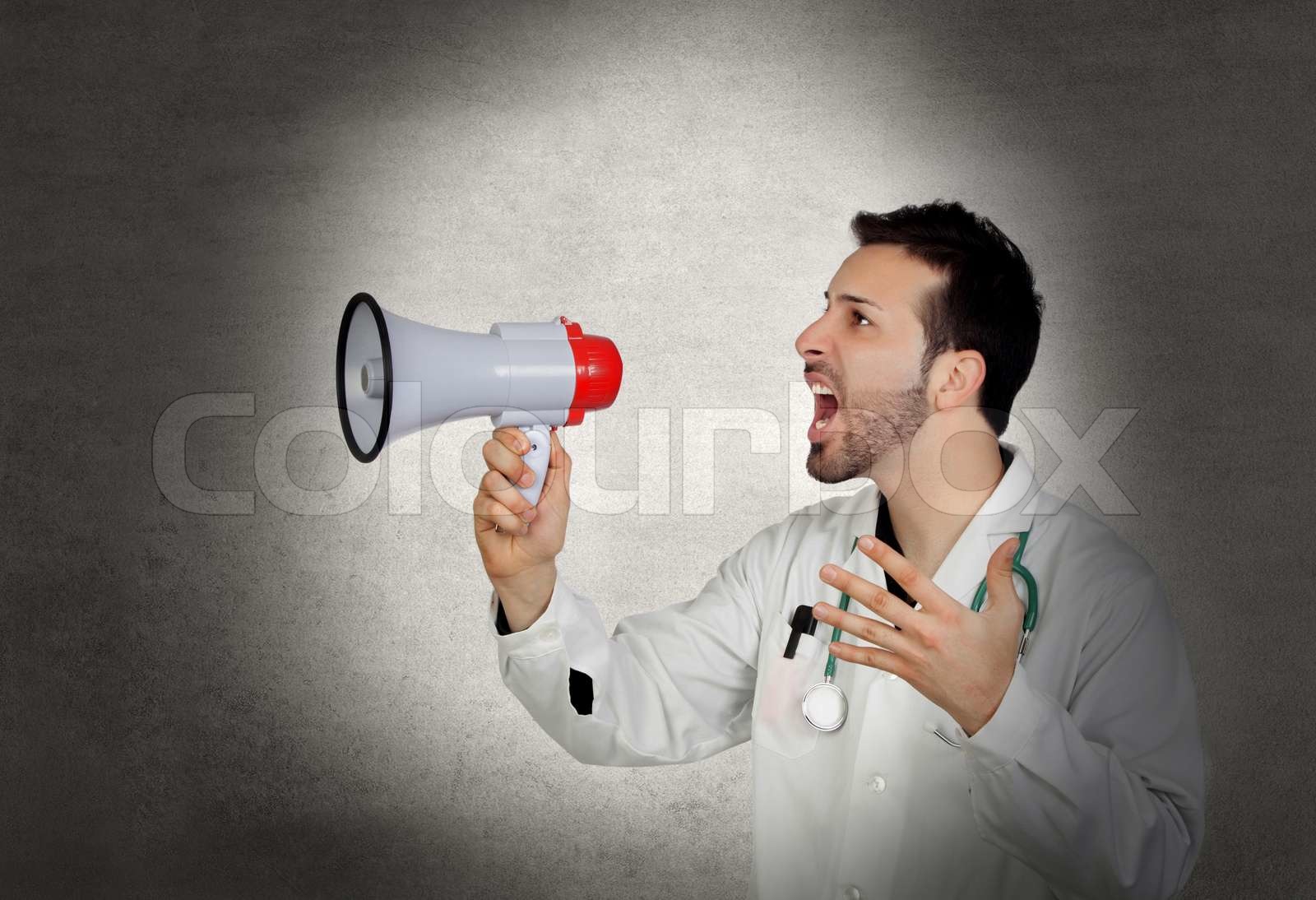 Doctor shouting whit a megaphone | Stock image | Colourbox