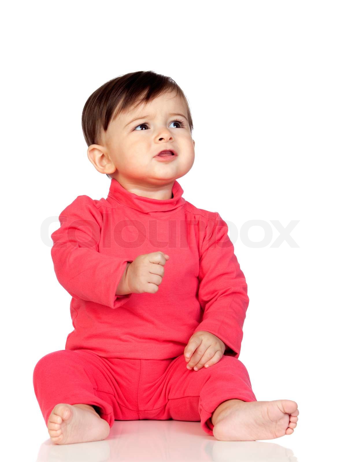 Adorable baby girl frowning | Stock image | Colourbox