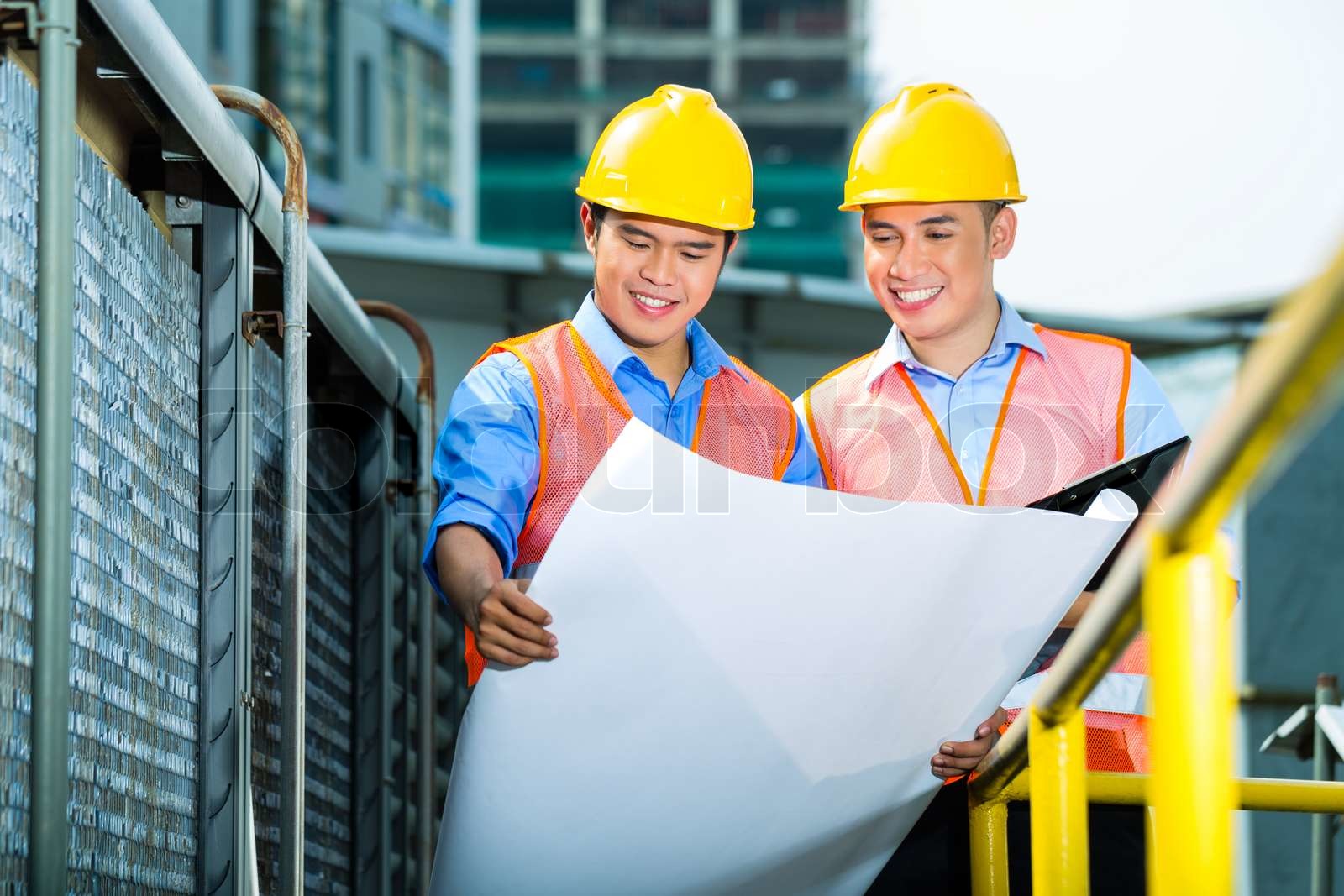 Asian Indonesian construction workers on building site | Stock image ...