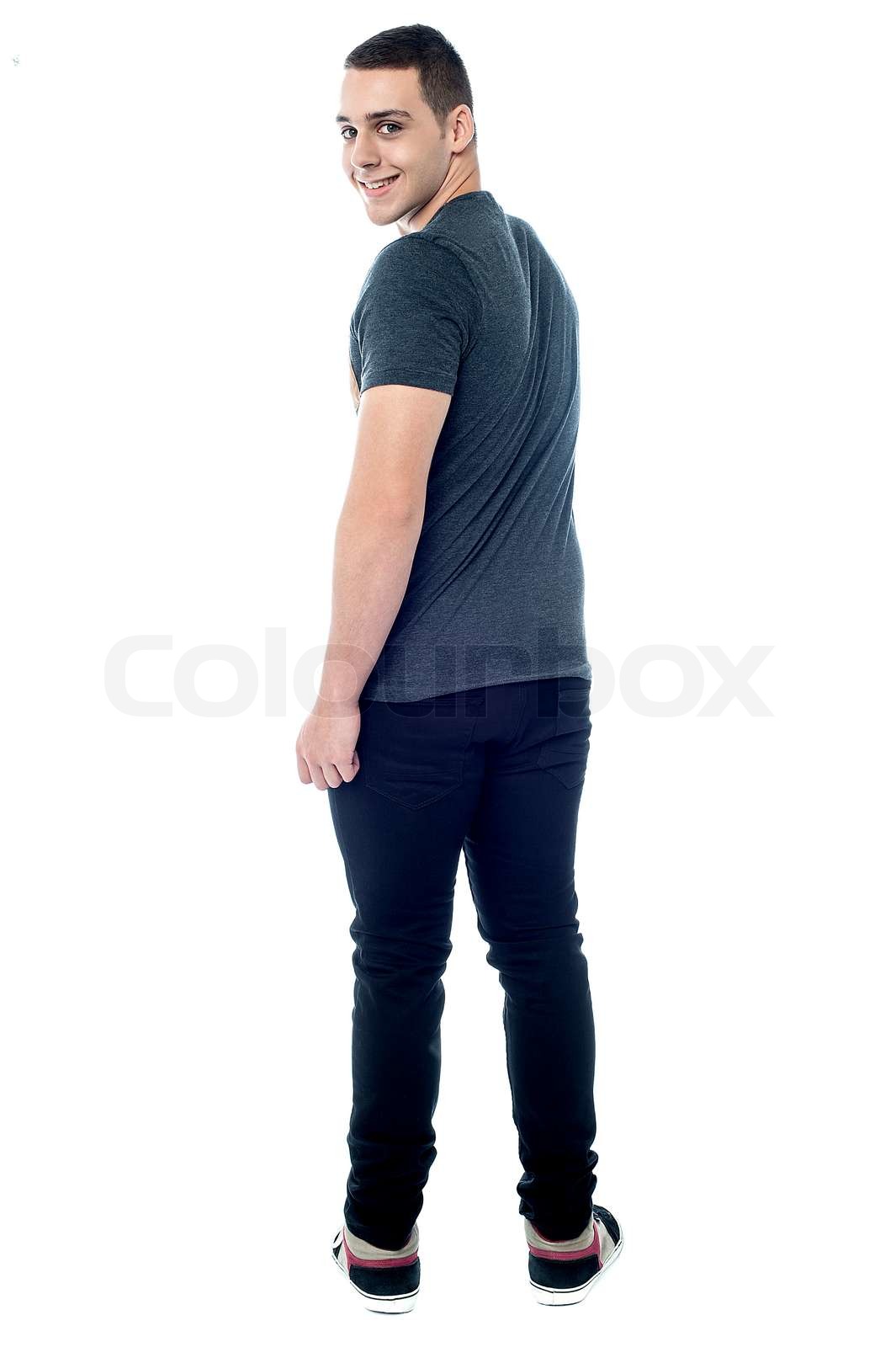 Handsome young guy looking back | Stock image | Colourbox