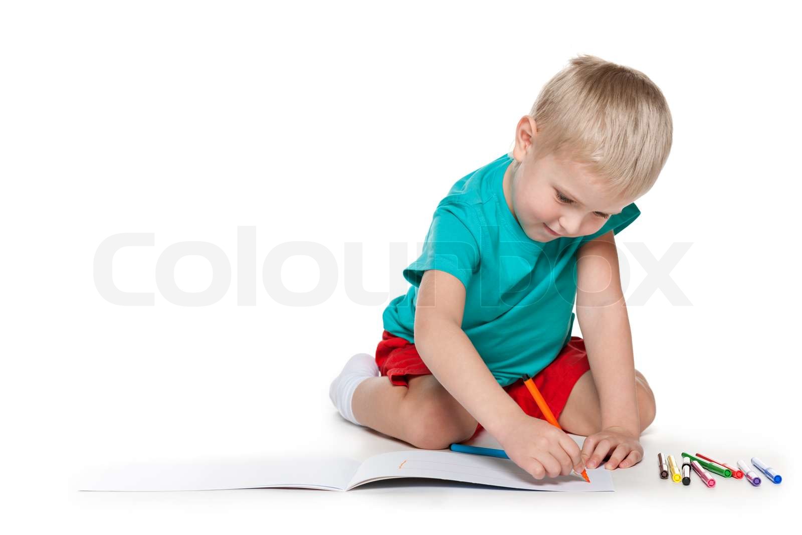 Cute little boy drawing on paper | Stock image | Colourbox