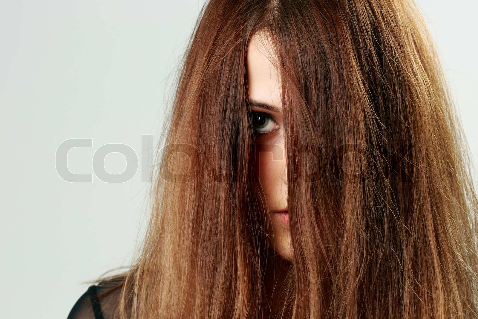 Closeup portrait of a young woman face covered with hair | Stock image ...