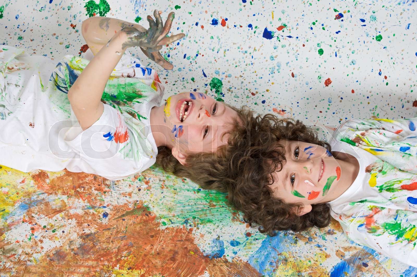 Children playing with painting | Stock image | Colourbox