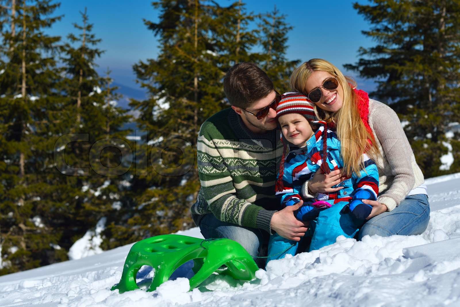 family having fun on fresh snow at winter | Stock image | Colourbox