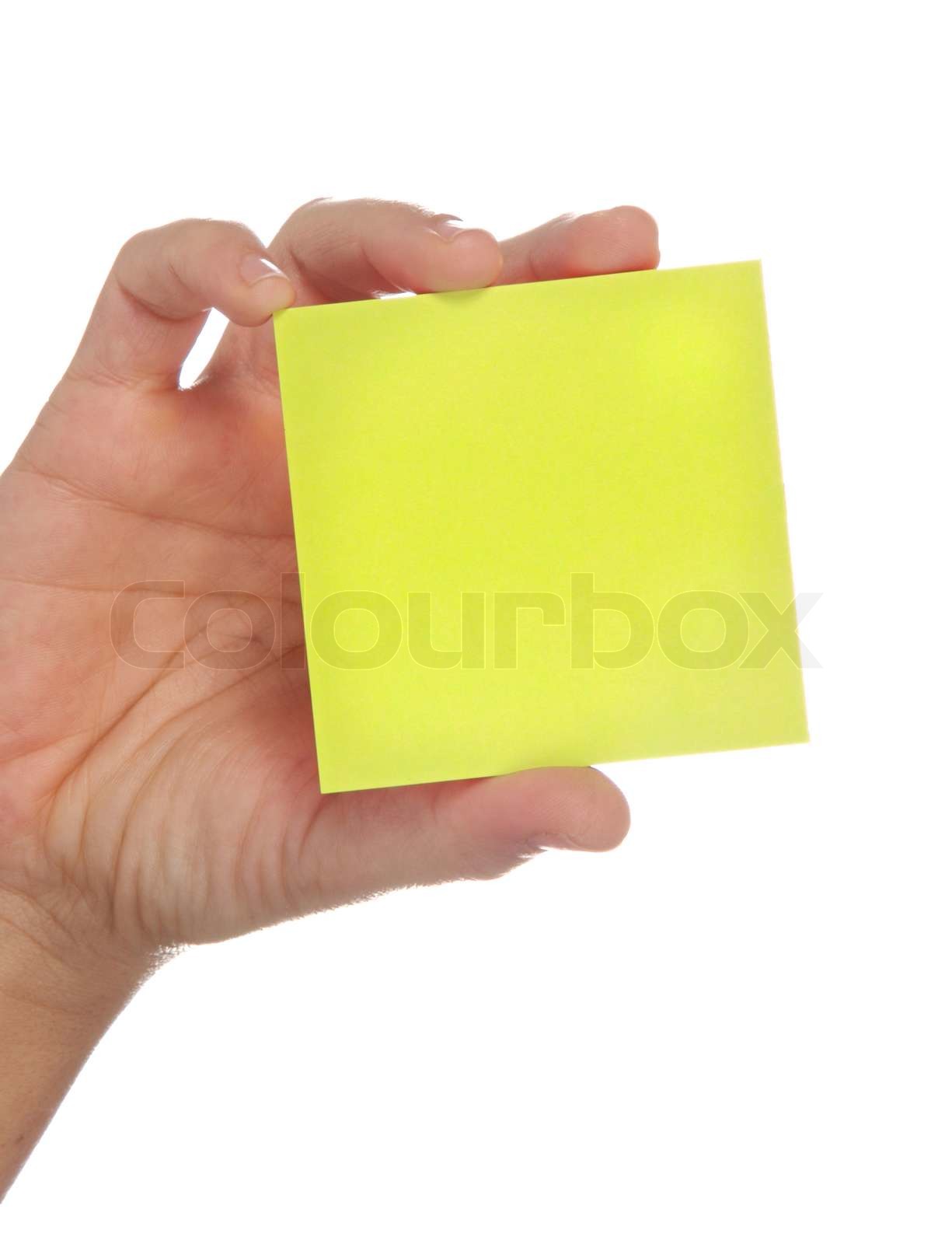 Hand holding a yellow note | Stock image | Colourbox