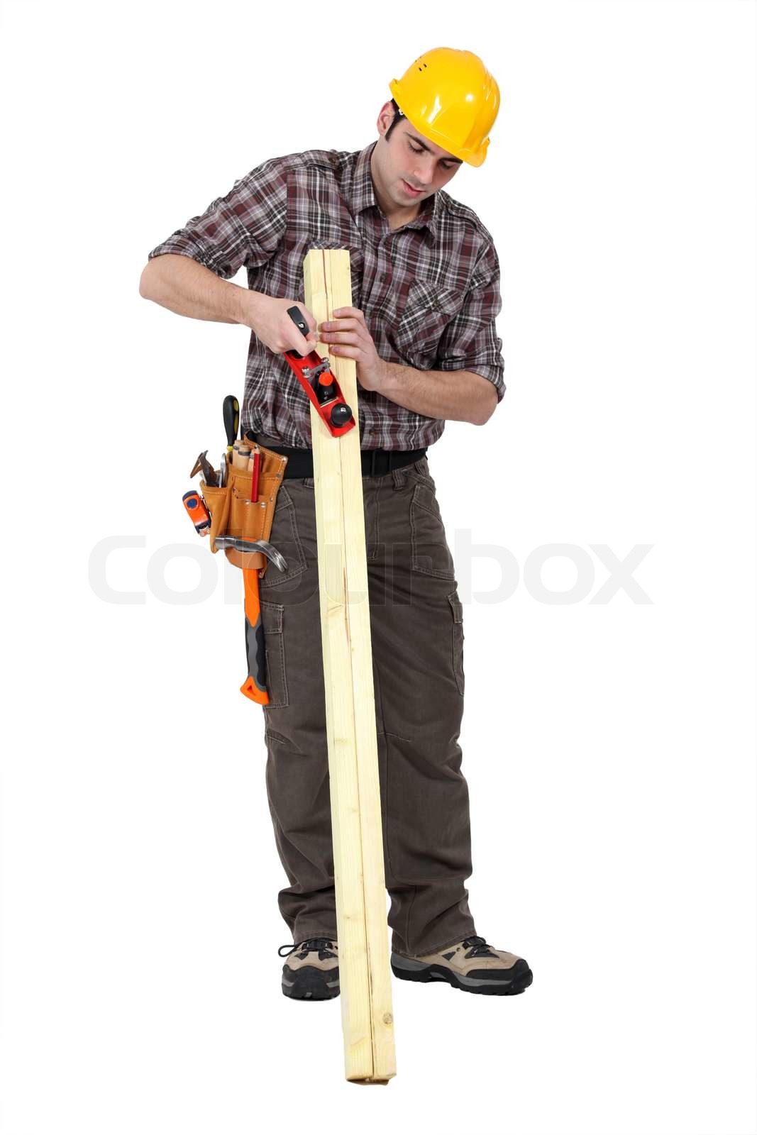 Carpenter using a tool | Stock image | Colourbox