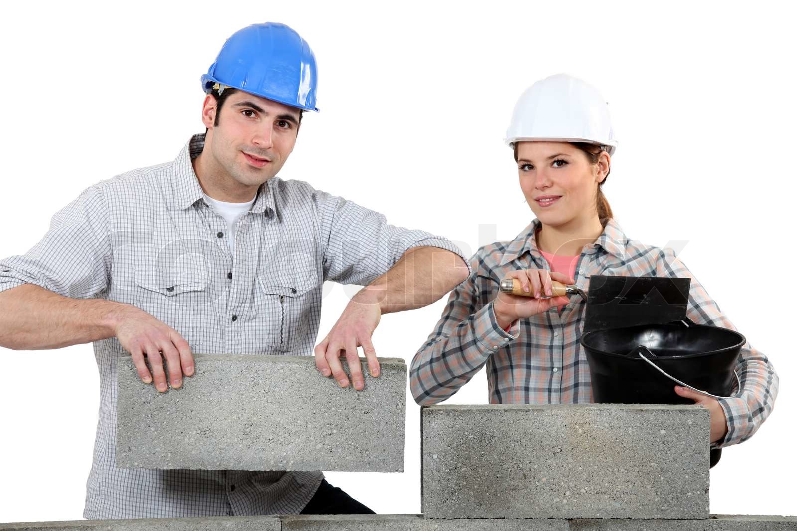Man and woman building a house | Stock image | Colourbox