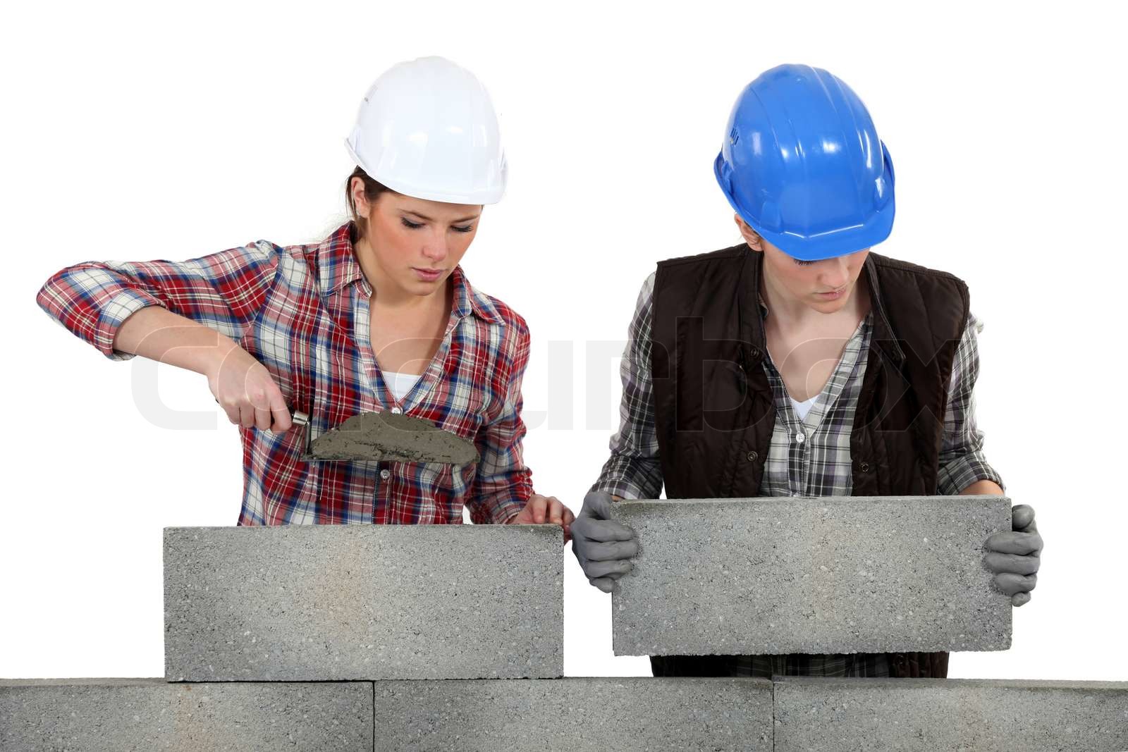 Two female bricklayers | Stock image | Colourbox