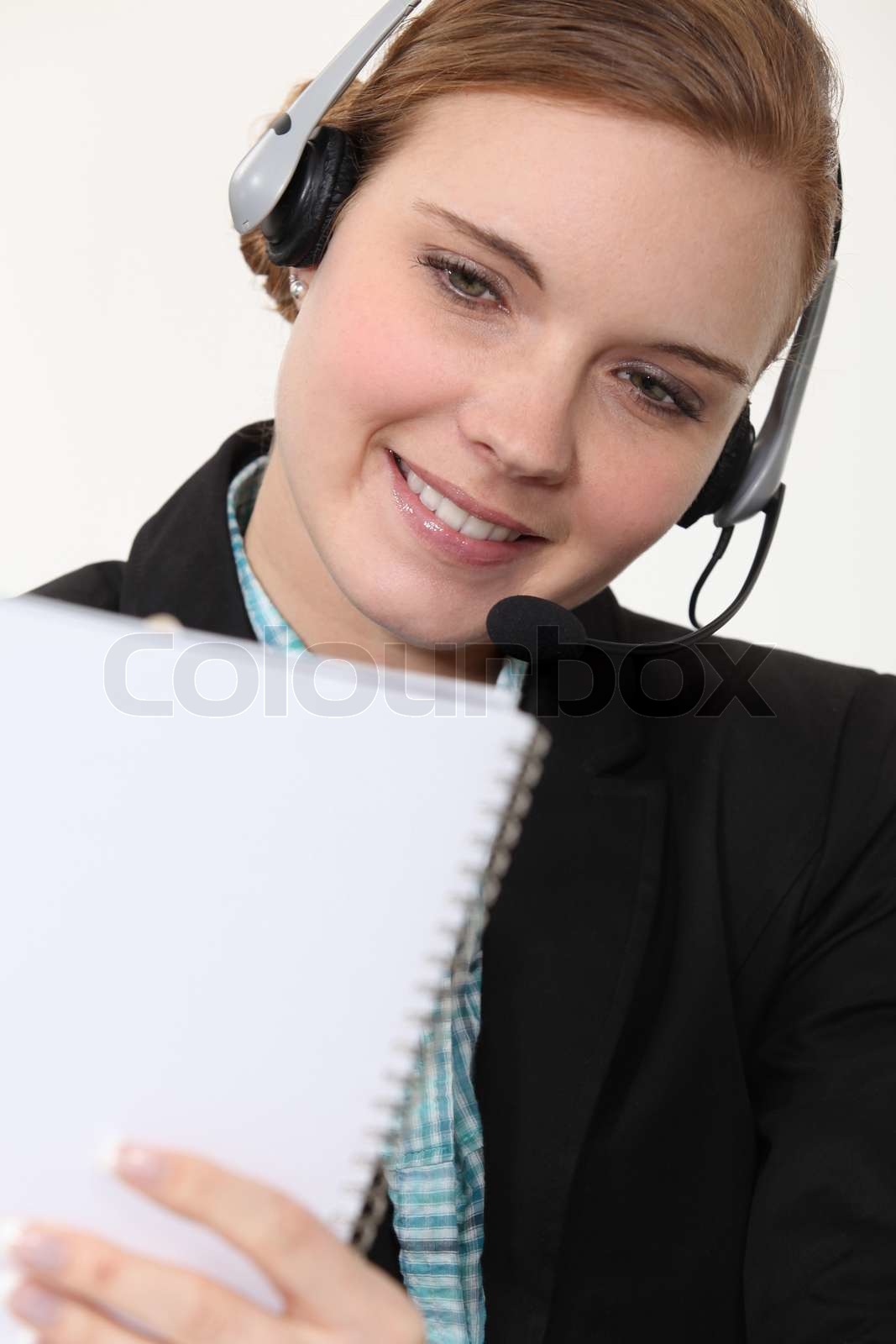 beautiful blonde receptionist holding notebook | Stock image | Colourbox