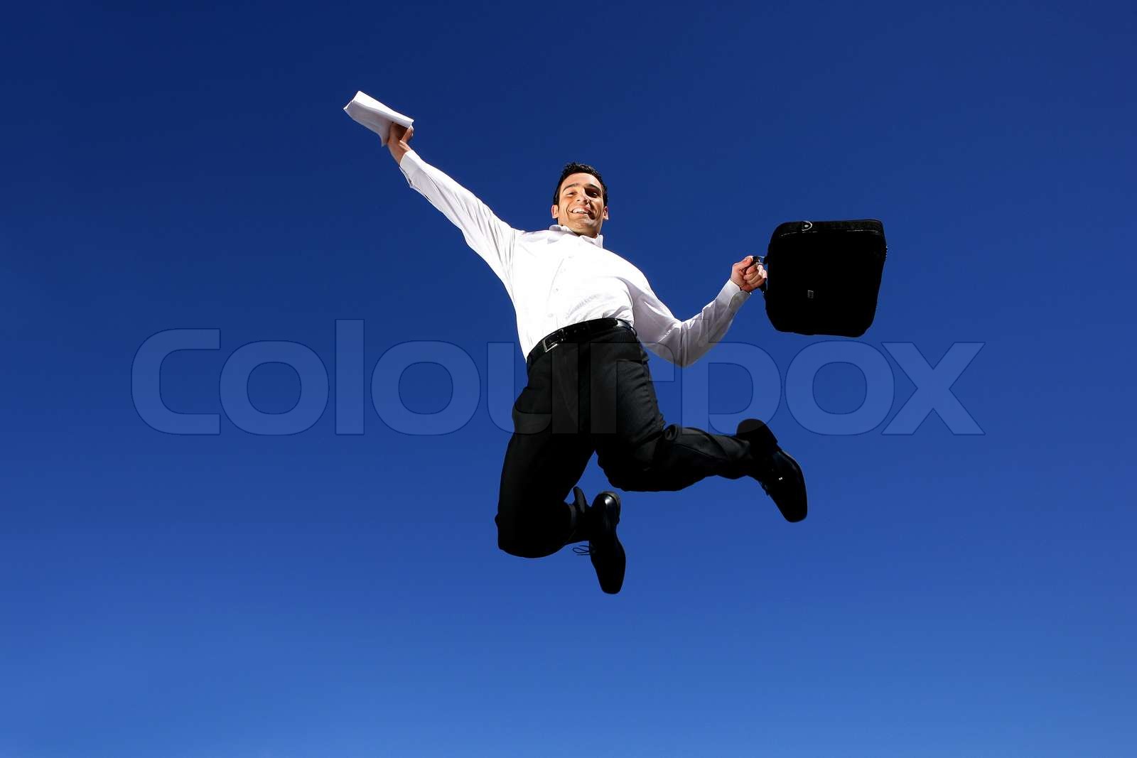 erfolgreicher Geschäftsmann in die Luft springen | Stock Bild | Colourbox