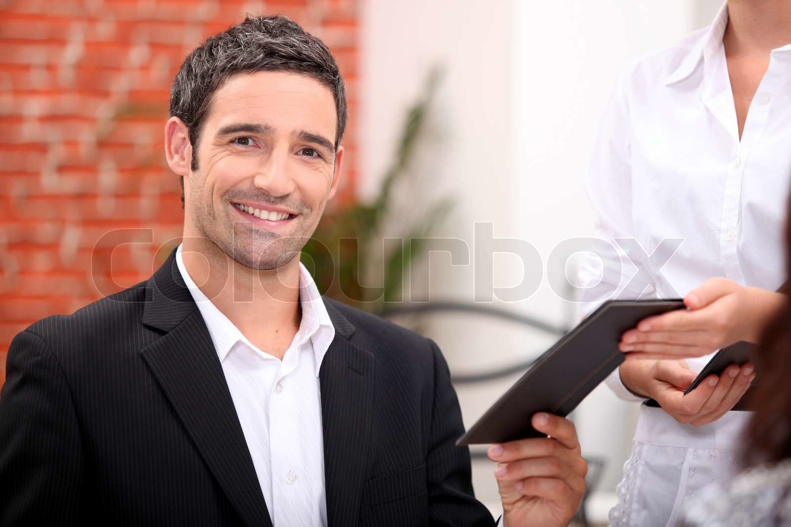 Man paying bill at restaurant | Stock image | Colourbox