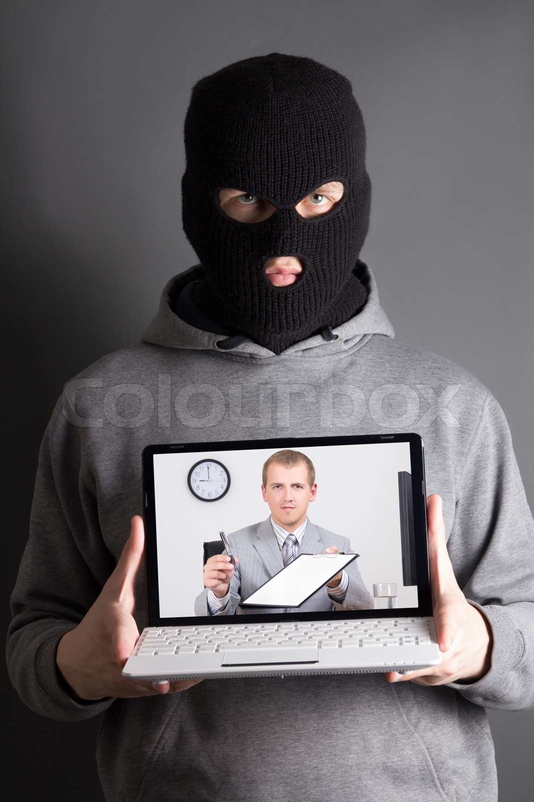 masked man with laptop - concept picture of internet crime | Stock ...