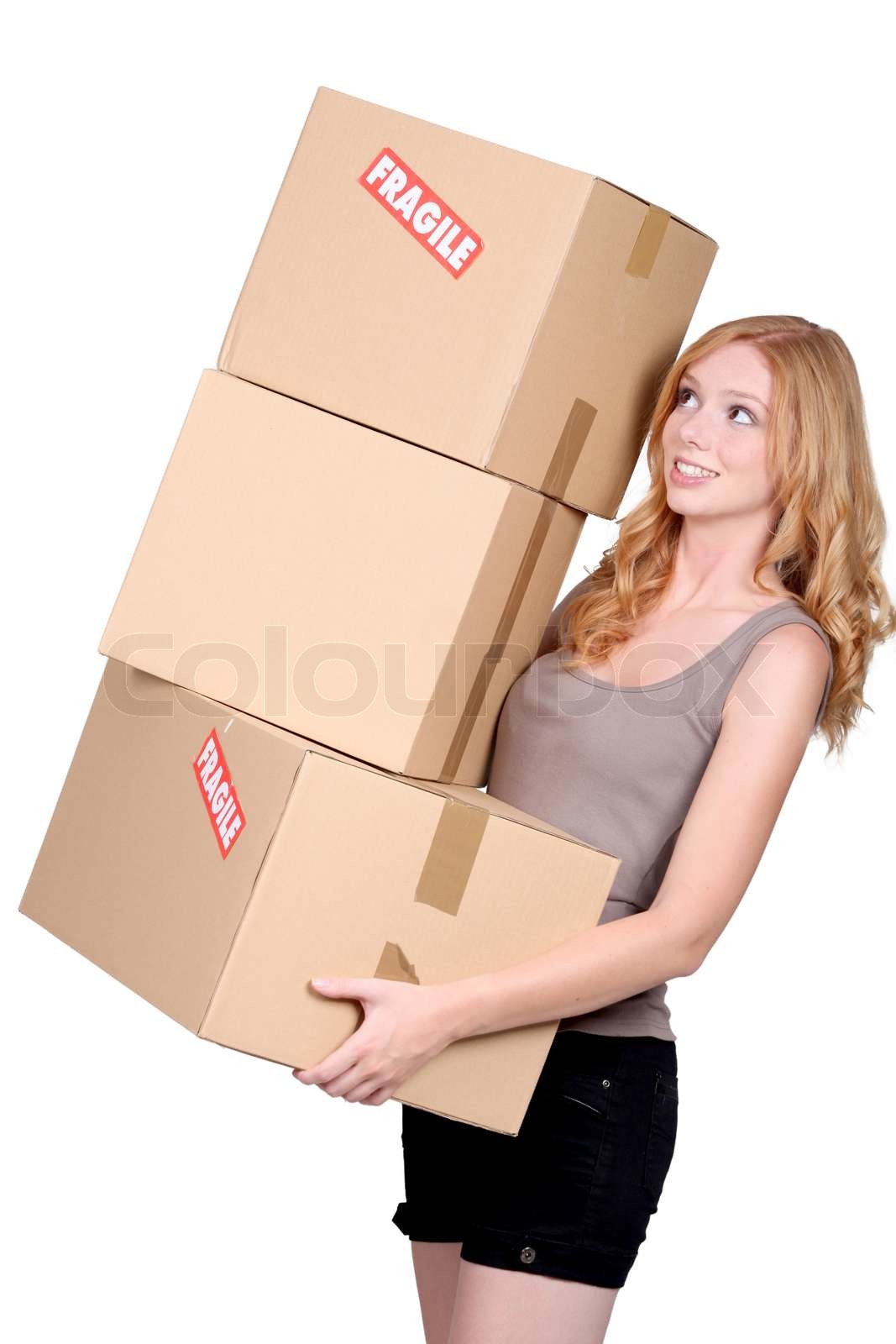 Woman carrying cartons | Stock image | Colourbox