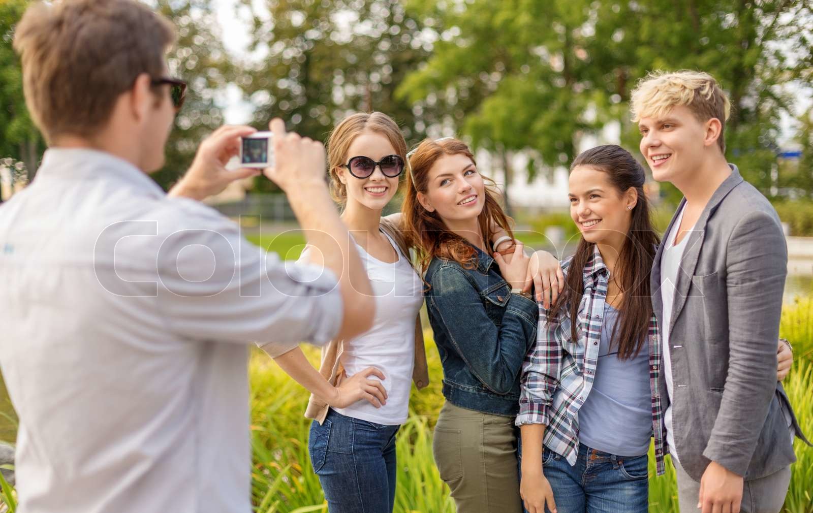 teenagers taking photo digital camera outside | Stock image | Colourbox