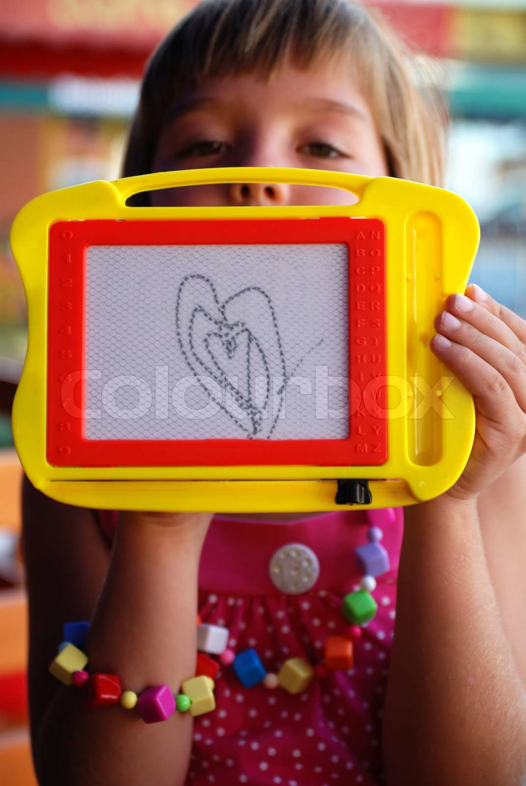 Cute litlle girl drawing | Stock image | Colourbox