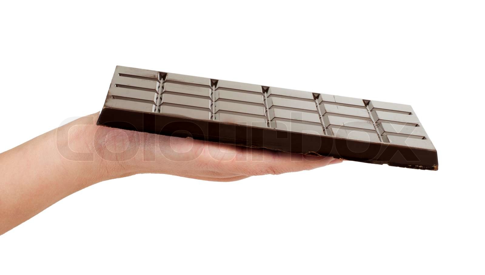 Hand holding chocolate bar | Stock image | Colourbox