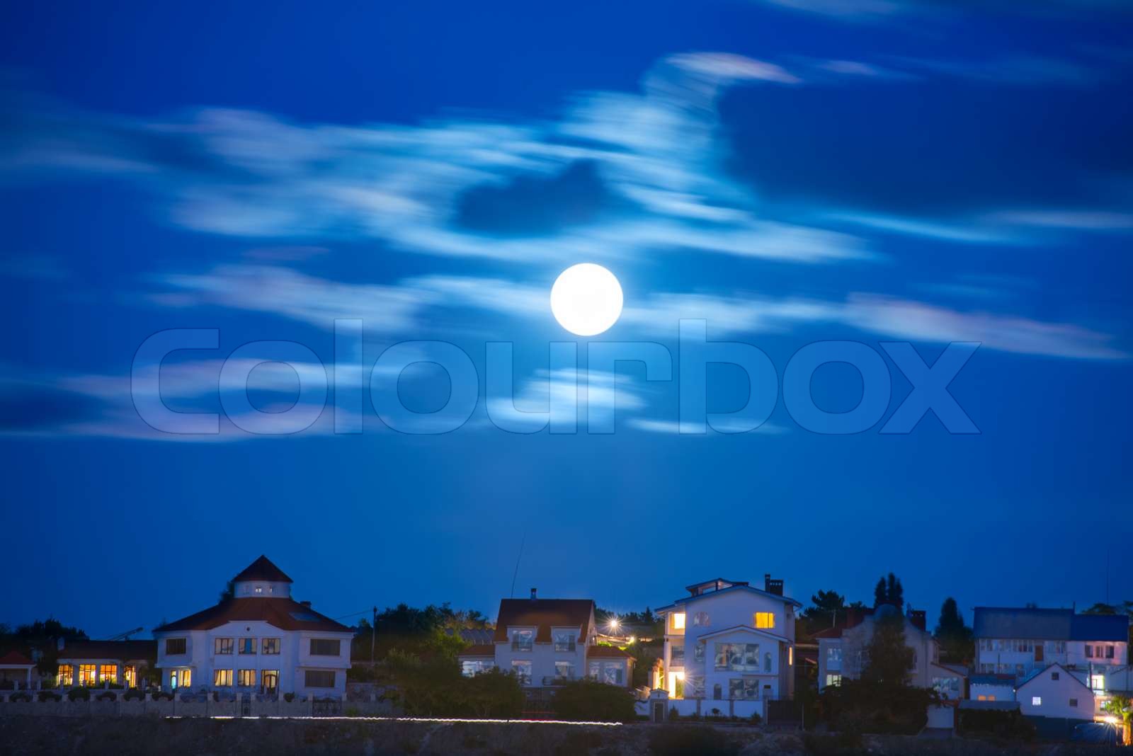Moon over the town | Stock image | Colourbox