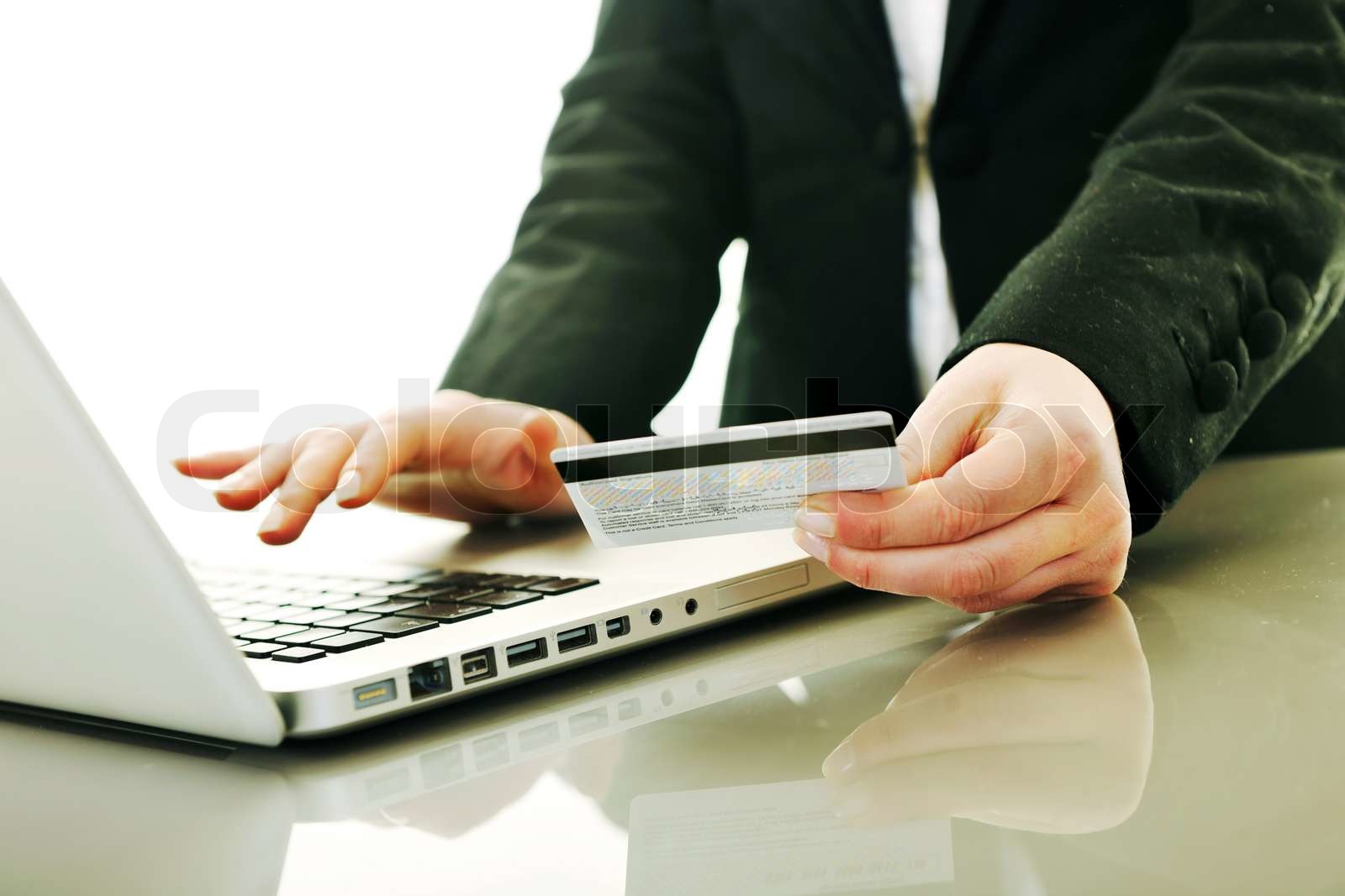 business woman making online money transaction | Stock image | Colourbox