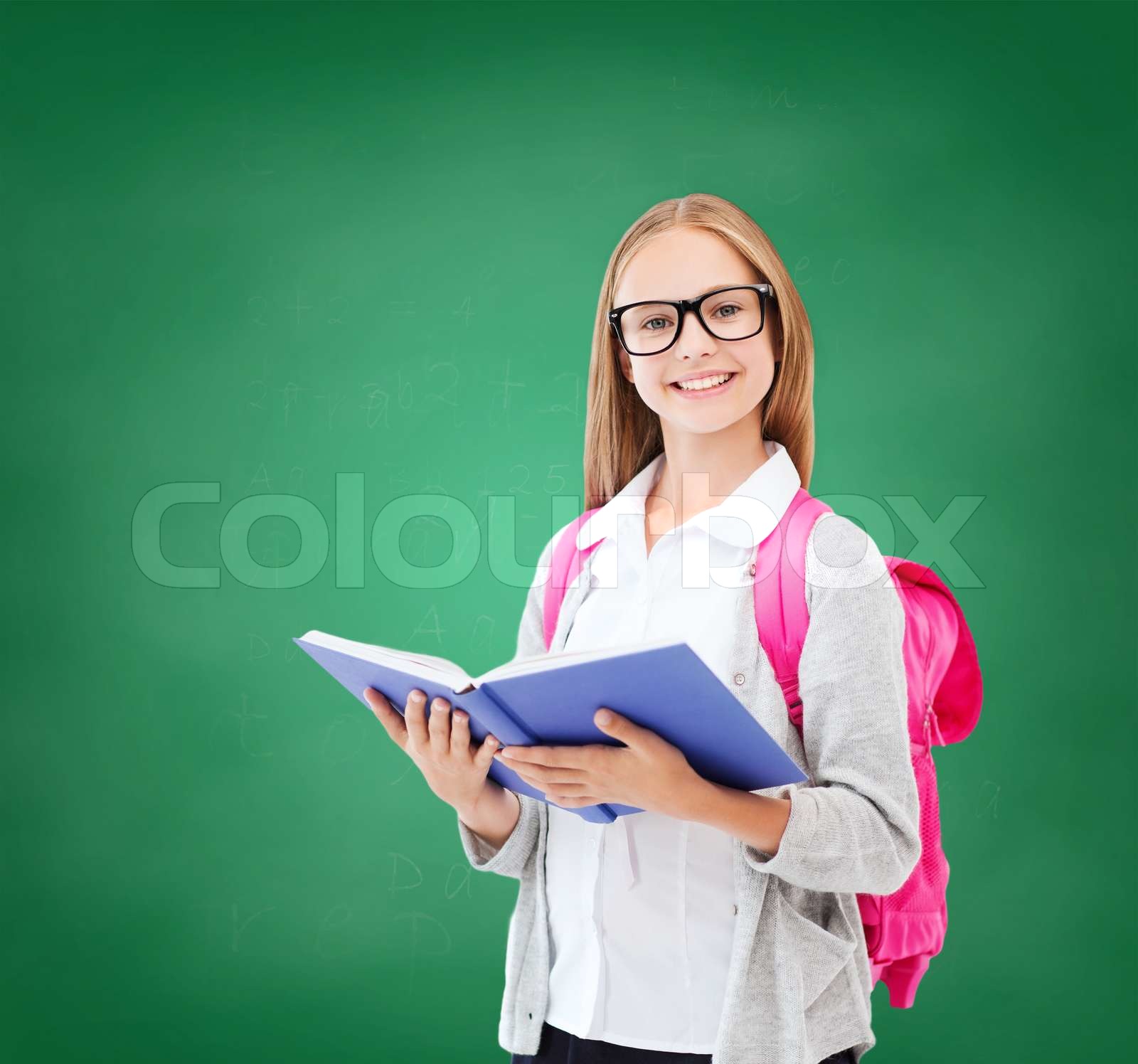 girl reading book at school | Stock image | Colourbox