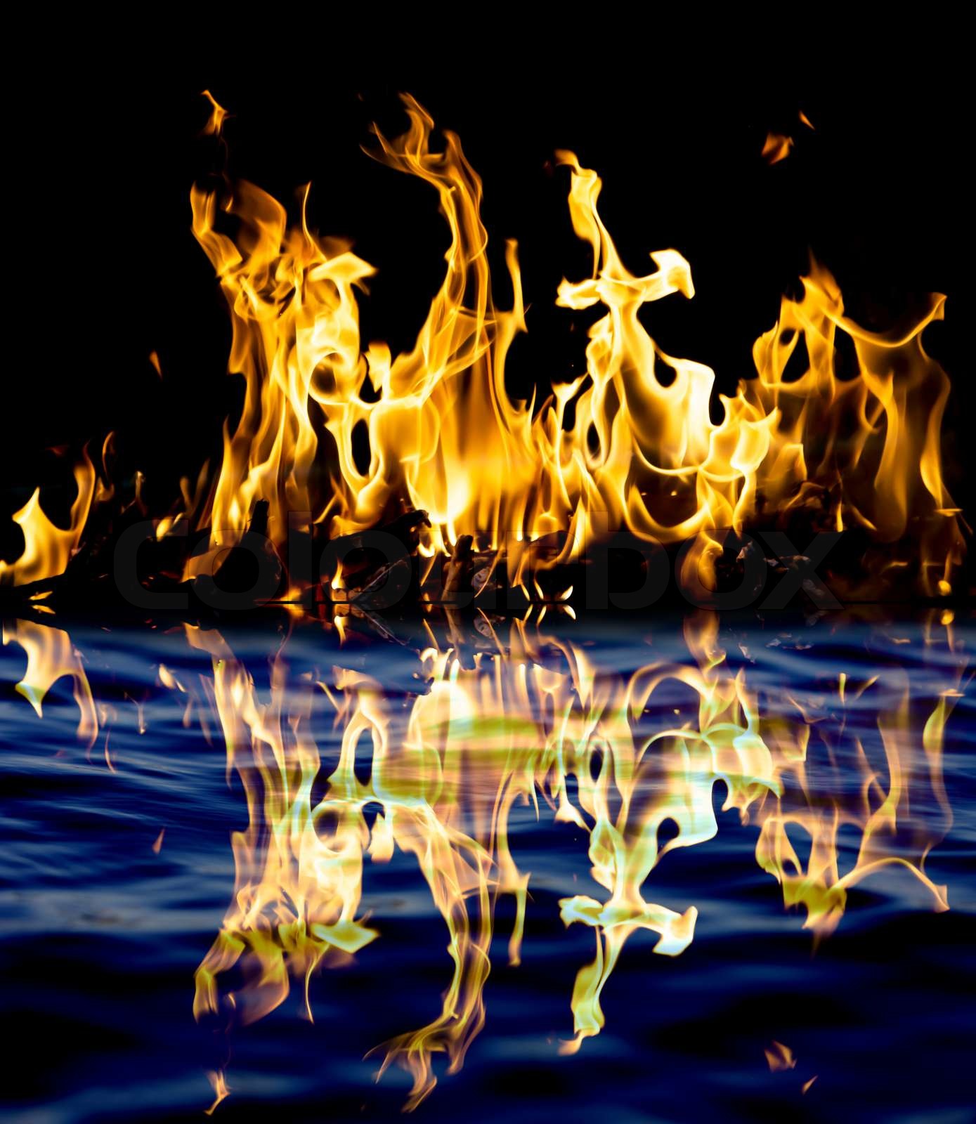 fire with reflection on water | Stock image | Colourbox