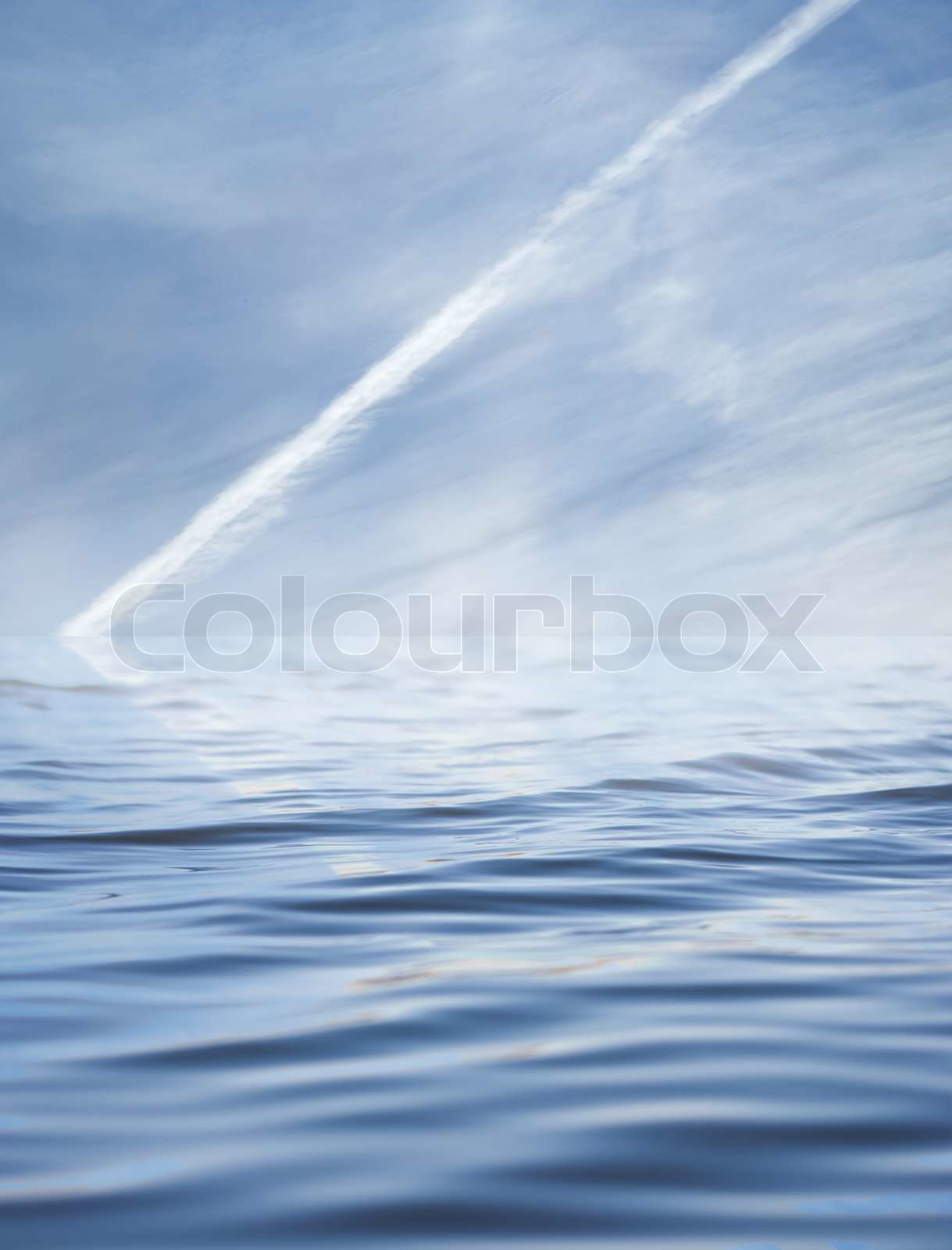 trace of the aircraft in the sky with reflection on water | Stock image ...