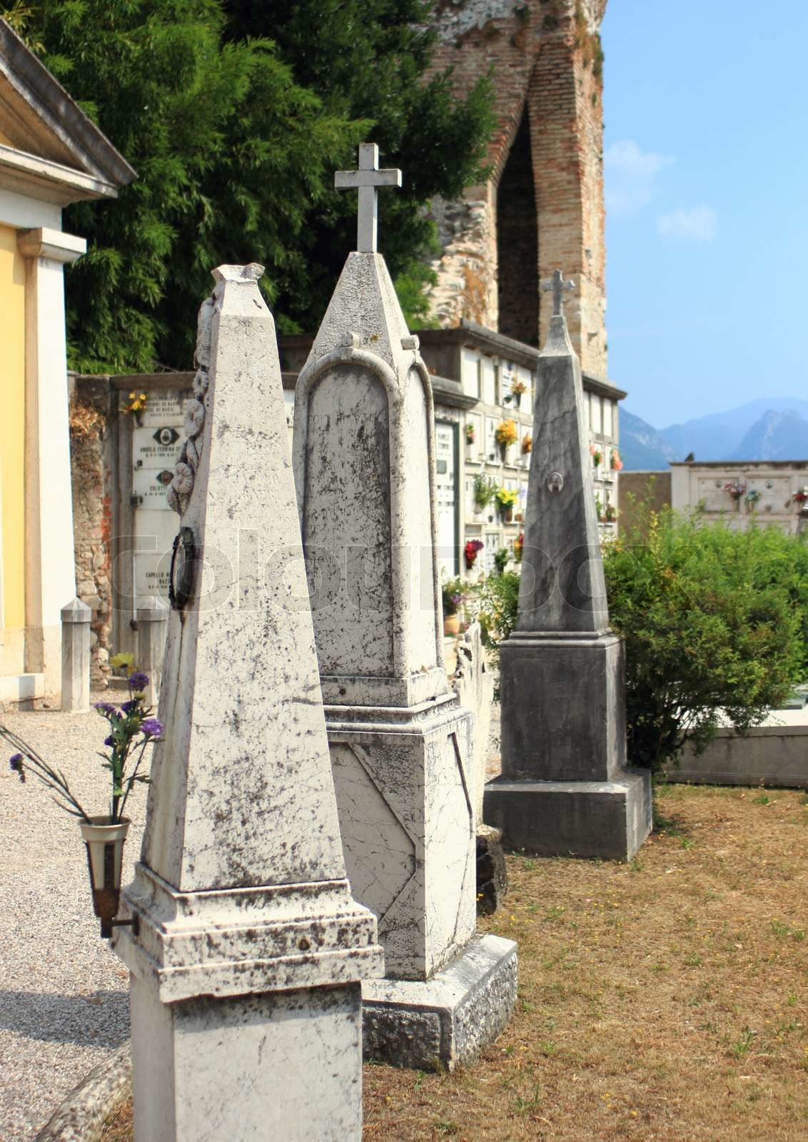 Tombstones at cemetery for urns in italian village | Stock image ...
