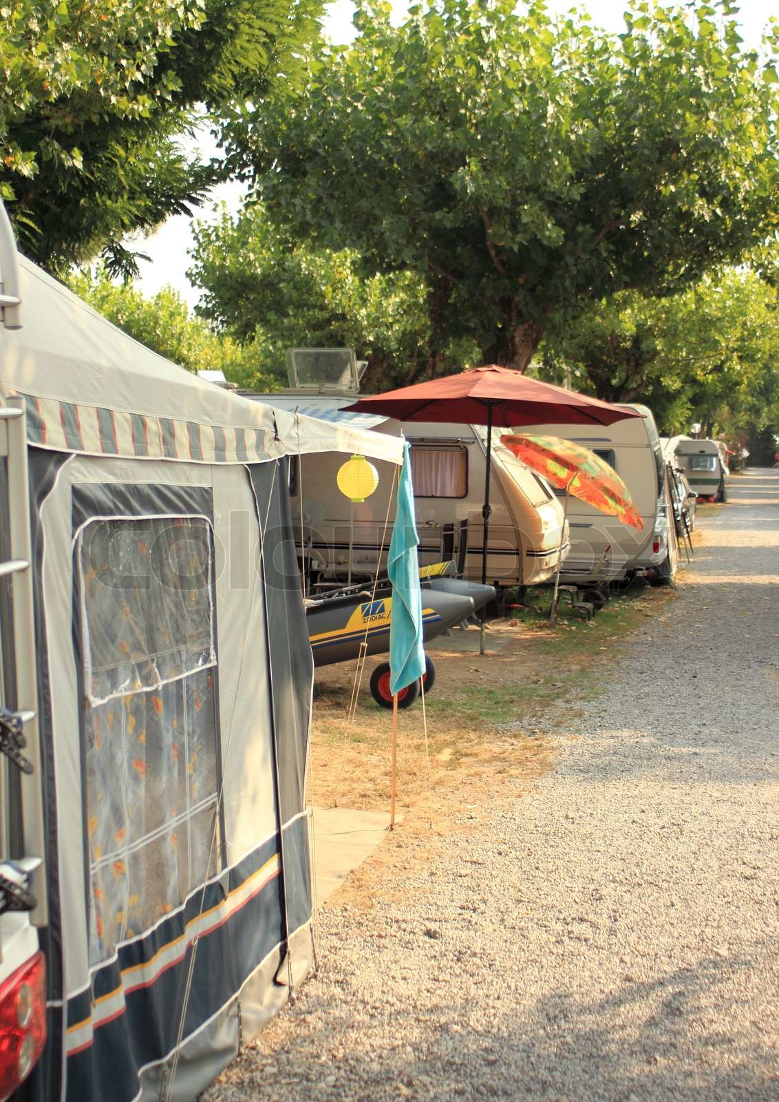 Caravans with tent on Italian camping ground | Stock image | Colourbox