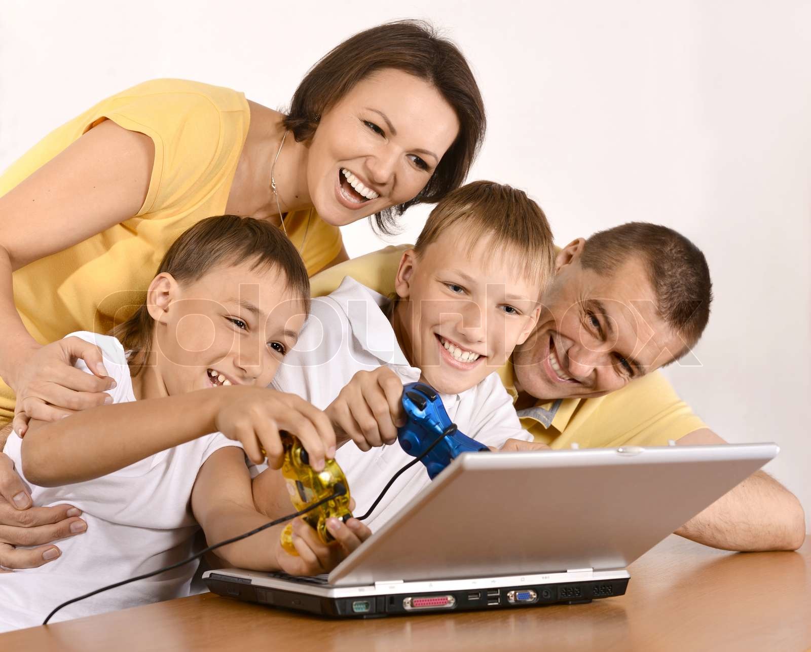 Happy family with computer | Stock image | Colourbox