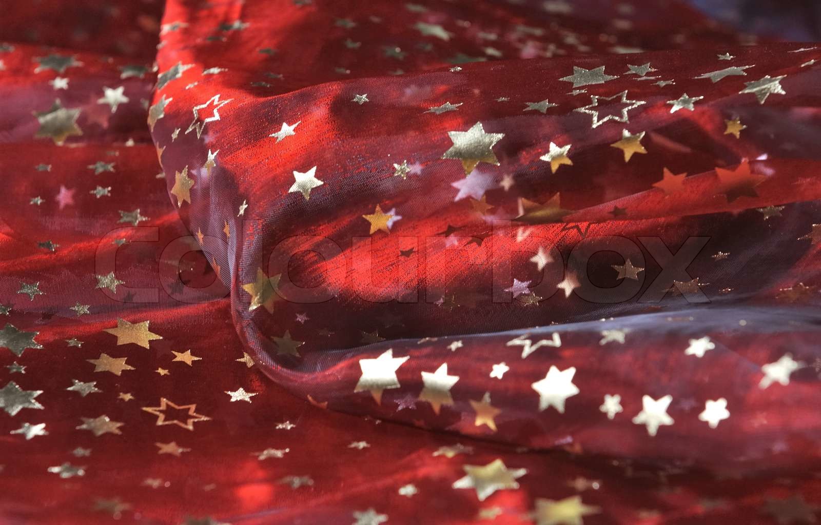 red cloth with golden stars | Stock image | Colourbox