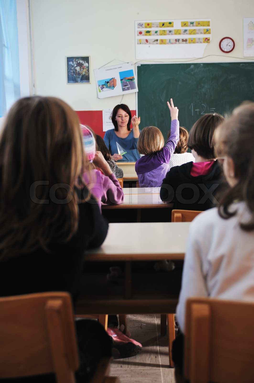 happy teacher in school classroom | Stock image | Colourbox