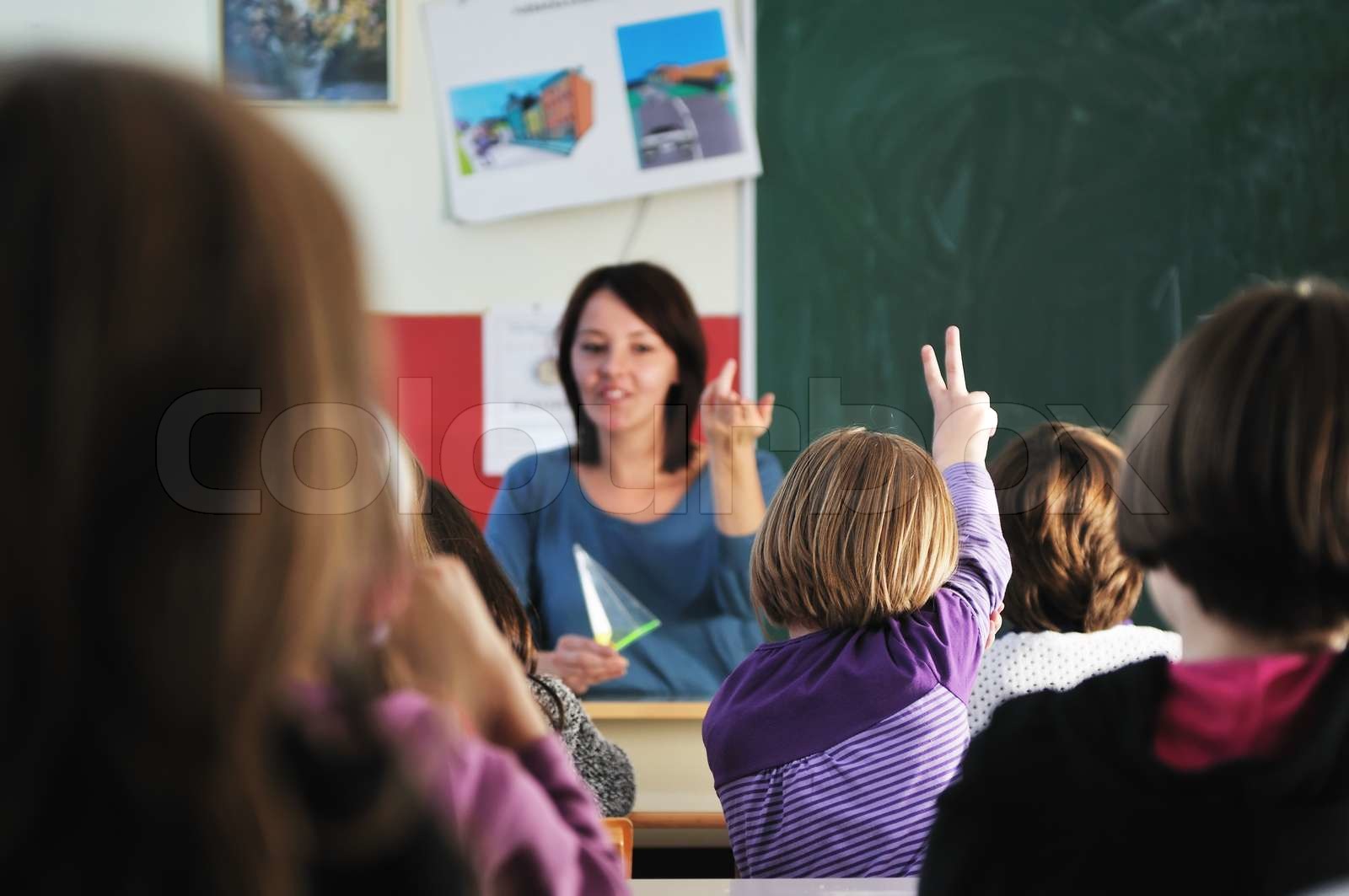 happy teacher in school classroom | Stock image | Colourbox