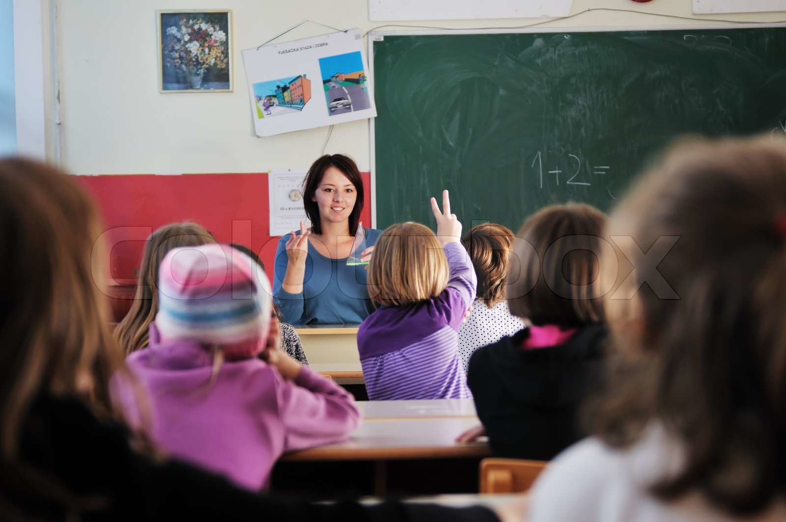 happy teacher in school classroom | Stock image | Colourbox