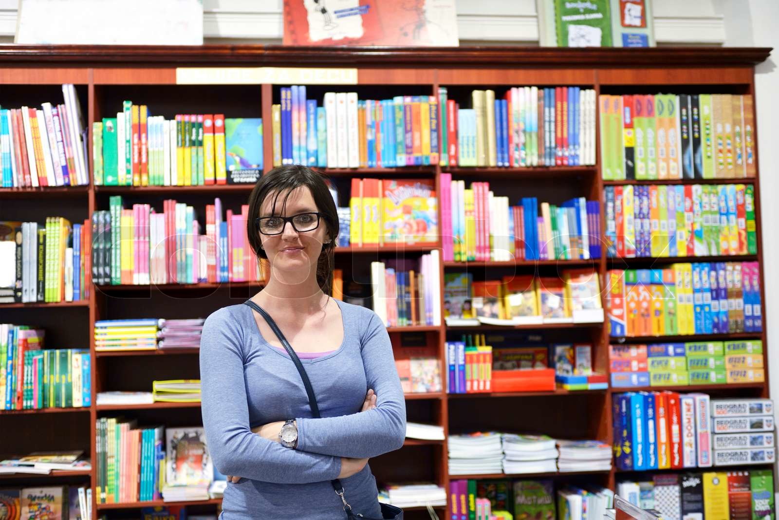 female in library | Stock image | Colourbox