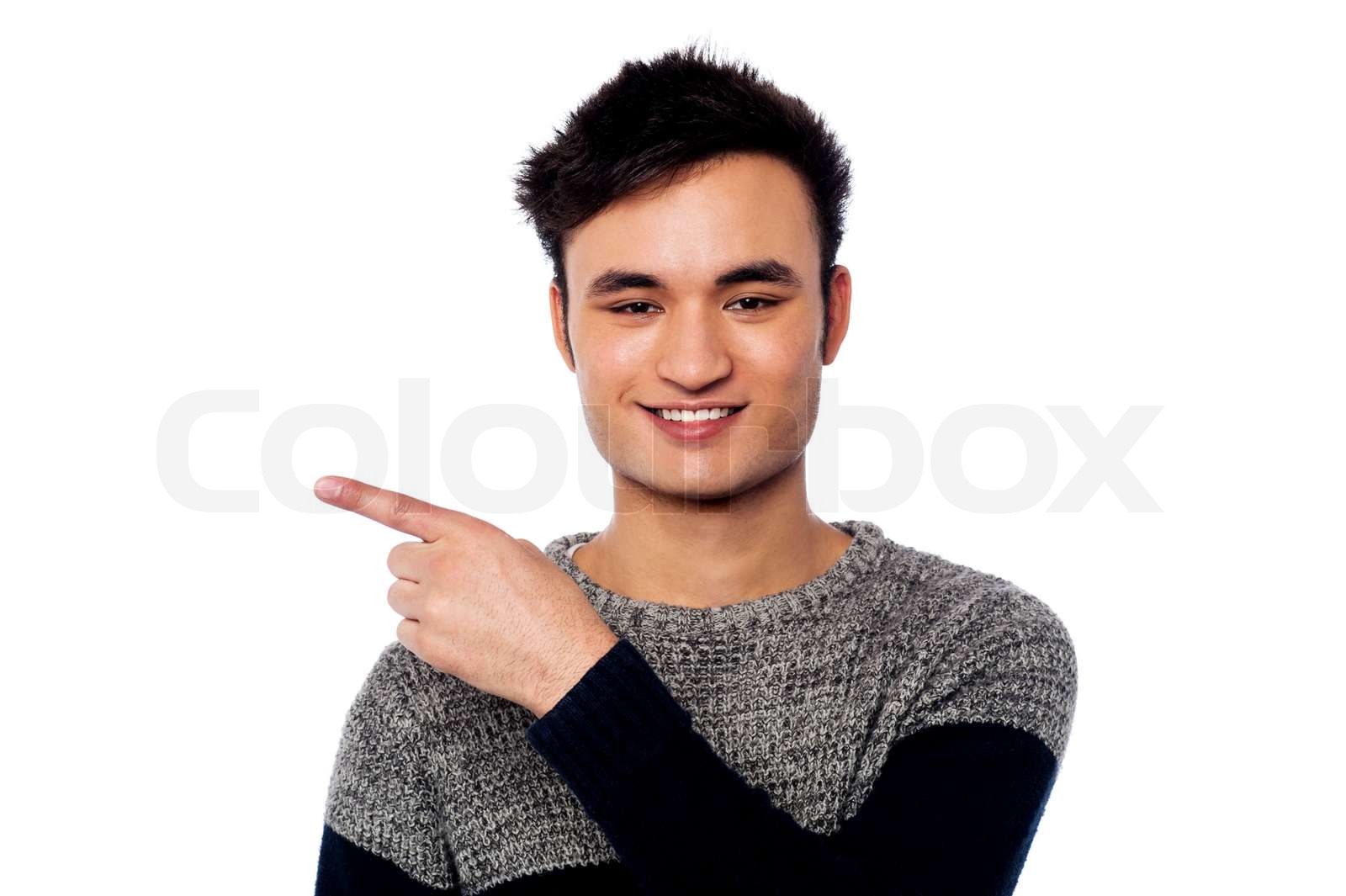 junger Mann auf etwas zeigen | Stock Bild | Colourbox