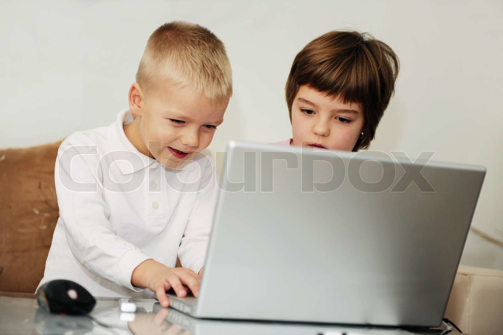 childrens have fun and playing games on laptop computer | Stock image ...