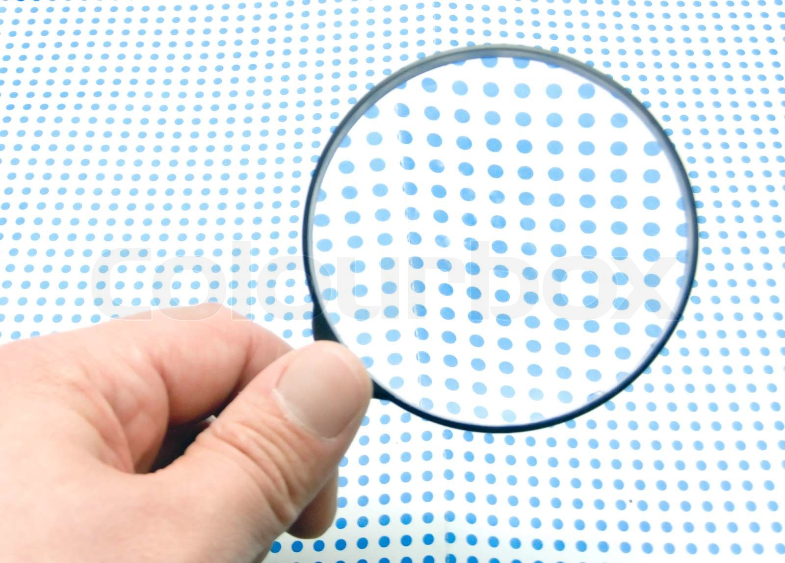 hand with magnifying glass | Stock image | Colourbox